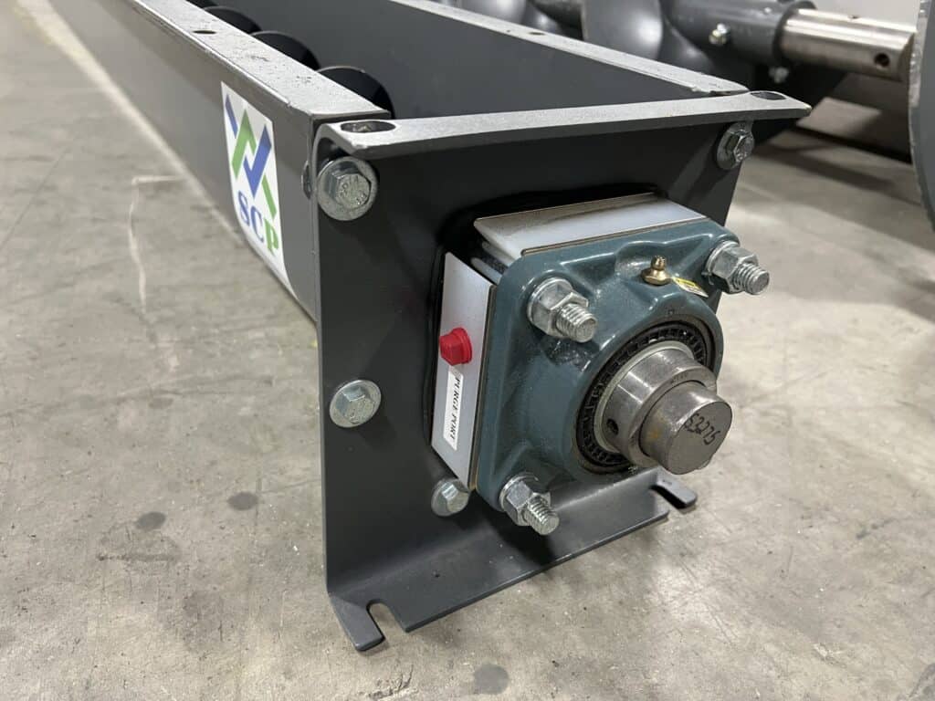 Which end does the screw conveyor drive go on?